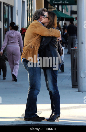 Greg Proops shares an intimate moment with his wife Jennifer Canaga ...