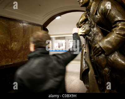 Superstitious Muscovites touch for good luck the shiny nose of a statue ...