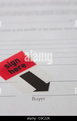 "Sign here" stickers on a contract Stock Photo - Alamy