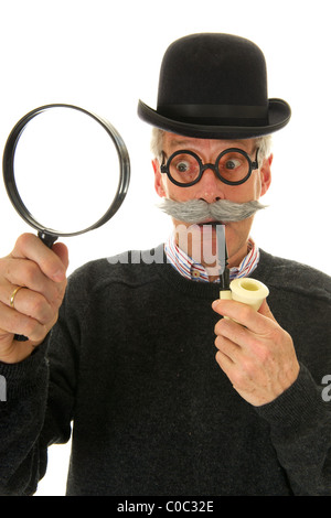 Portrait of a funny inspector with a big magnifier for investigation ...