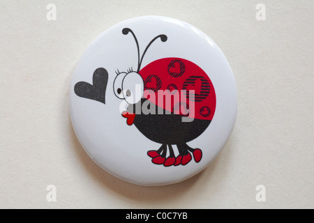 ladybird round pin badge isolated on white background Stock Photo - Alamy