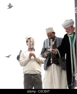 A Kashmiri Muslim cleric, Ghulam Hassan Banday, displays a relic (in ...