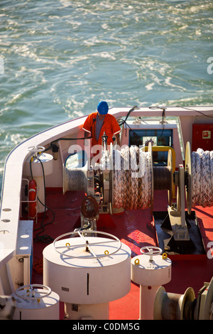 A deckhand on a North Sea ferry at work Stock Photo - Alamy