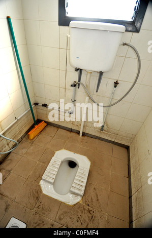 a hole in the ground public toilet in france Stock Photo - Alamy