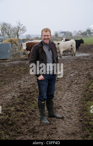 Adam Henson Cotswold farmer at Adam's farm. BBC Countryfile presenter with rare breeds Buff ...