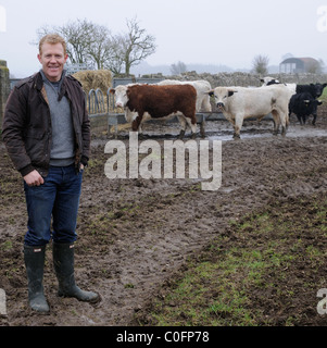 Adam Henson Cotswold farmer at Adam's farm. BBC Countryfile presenter with rare breeds Buff ...