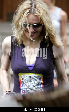 Madonna leaving the gym very sweaty and showing a large cleavage London ...