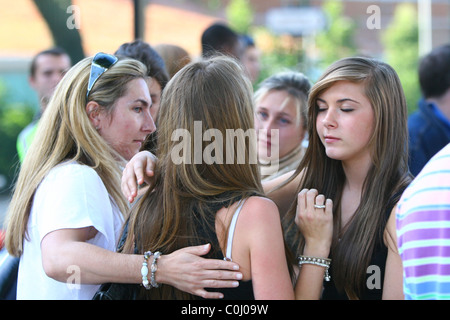 Mourners at the scene where 16-year-old Shakilus Townsend was stabbed ...