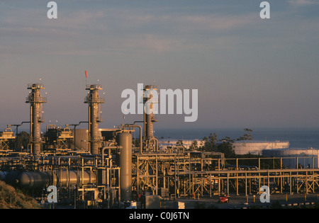 Onshore oil and gas processing plant showing pipework with oil ...