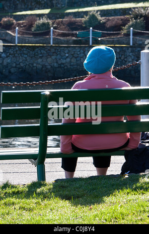 People sit on the grass at Victoria Tower Gardens at Westminster, in ...