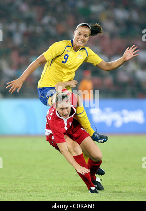 Jessica Landstrom of Sweden competes for the ball in the group match ...