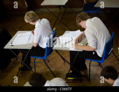 Pupils fill an exam hall to take a GCSE exam at Maidstone Grammar ...