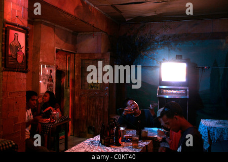Patrons sing in a karaoke bar in Adriatico Street, Malate, Manila, the ...