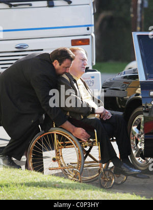 Larry Flynt gets picked up in his golden wheelchair by his driver while ...