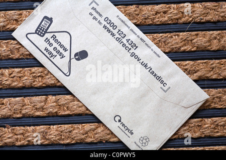 Car tax renewal reminder letter on door mat Stock Photo - Alamy