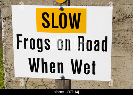 Road sign warning of frogs on the road. Sited near a pond next to the ...