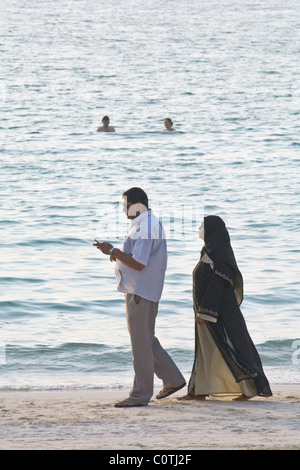 arabian man using his mobile phone while working for communication ...