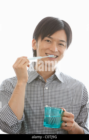 Japanese man brushing teeth Stock Photo - Alamy