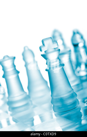 Chess game with glass transparent chess on translucent chessboard. King ...