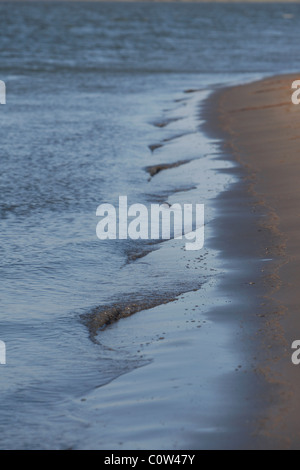 South Texas: Small waves lap at the shore on an undeveloped area at the ...