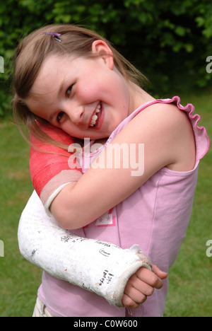Little girl with two broken arms Stock Photo - Alamy