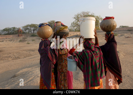 Women fetching water from a well, Cameroon, Africa Stock Photo - Alamy