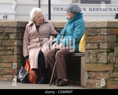 Two elderly ladies sit chatting at a party in the 1960s Stock Photo - Alamy