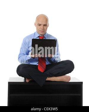 Bald male, in meditation pose, relaxing, in zen, isolated on background ...