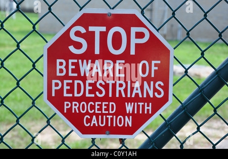 A red warning sign reads 'Danger No Bathing' and in Welsh 'Perygl Dim ...