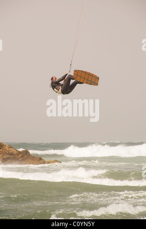 Kite surfer jumping on a gray winter day Stock Photo - Alamy