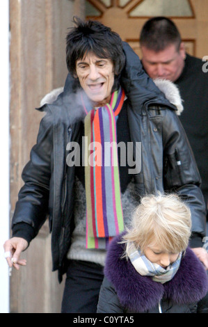 Ekaterina Ivanova and Ronnie Wood take their dog to visit a pet shop ...