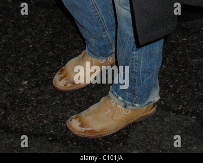 Keanu Reeves arriving at his hotel wearing old brown shoes London ...