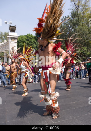 Prehispanic (Aztec) dance group performing during a parade in Mexico ...