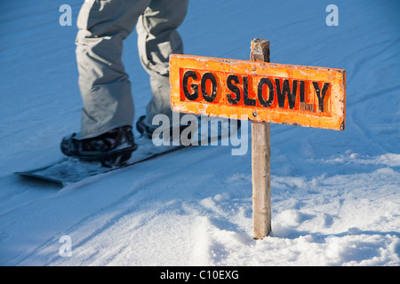 "Slow skiing" warning sign on ski slope in ski resort with majestic ...