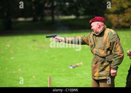 Reconstruction WW2 British soldier firing Thompson sub-machine gun with ...