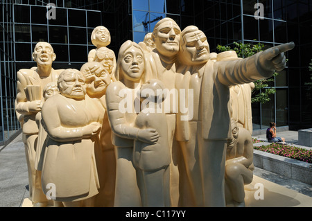 Illuminated Crowd Sculpture by Raymond Masson in front of a skyscraper ...