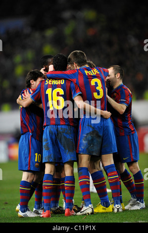 Players of FC Barcelona celebrating a goal during the champion league ...