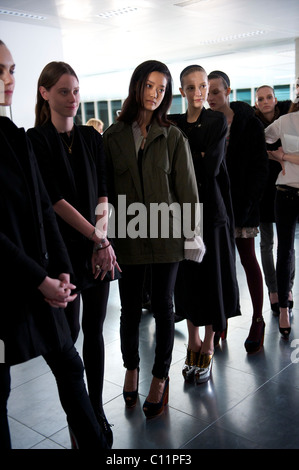 Models line up backstage before Jonathan Saunders autumn 2011 ...