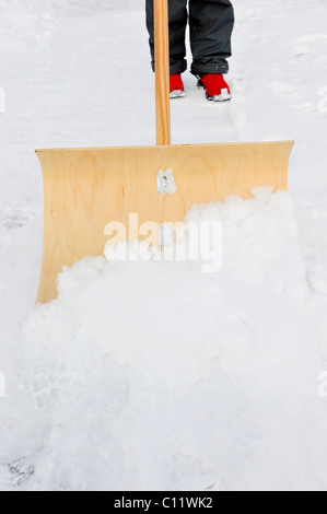 People shovel snow during a winter storm, Sunday, Jan. 25, 2026, in the ...