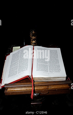 Open bible book on lectern in small empty church All Saints and St ...