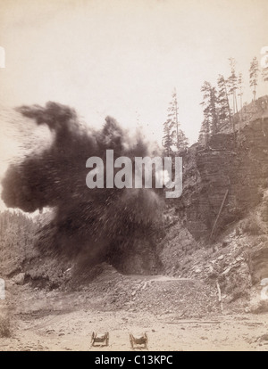 Smoke from a dynamite blast during railroad construction near Deadwood ...