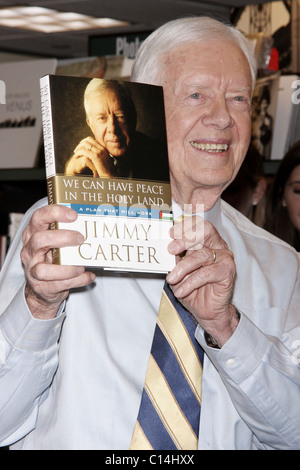 Former President Jimmy Carter signs copies of his new book "A ...