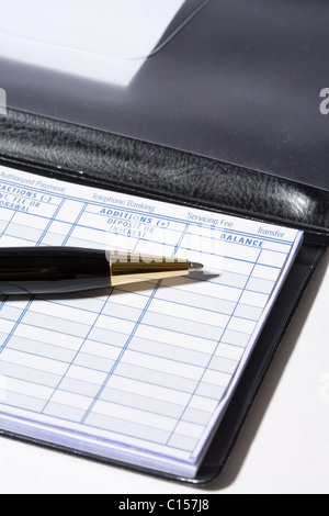 Checkbook and pen with white background Stock Photo - Alamy