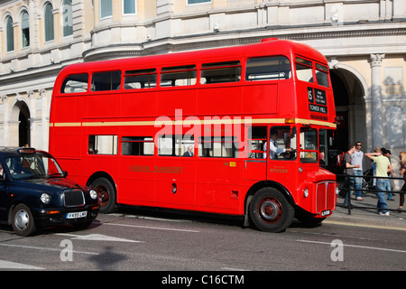 London single decker bus with passengers approaching Victoria Railway ...