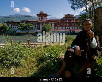 An older Bhutanese man in the traditional gho robe in Thimphu, Bhutan ...