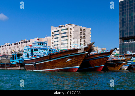 Rustic river Dow boats in Dubai Creek in Dubai, UAE Stock Photo - Alamy