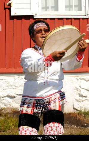 Inuit wearing a traditional costume, folklore in front of a museum in ...