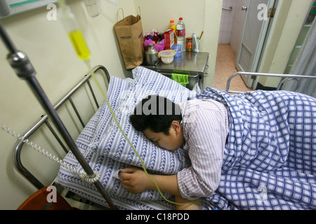 Man knocked unconscious by broken loo A Chinese man is rescued from a ...