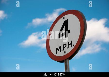 A 4MPH speed limit sign on the bank of a river Stock Photo - Alamy