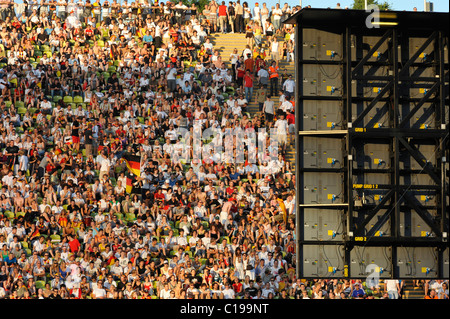 Crowds in the stands of Olympic Stadium, with runners on the starting ...